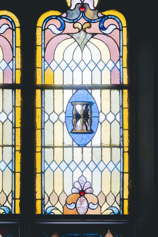 A Couple of Windows Sitting Next To Each Other on a Wall Stock Photo ...