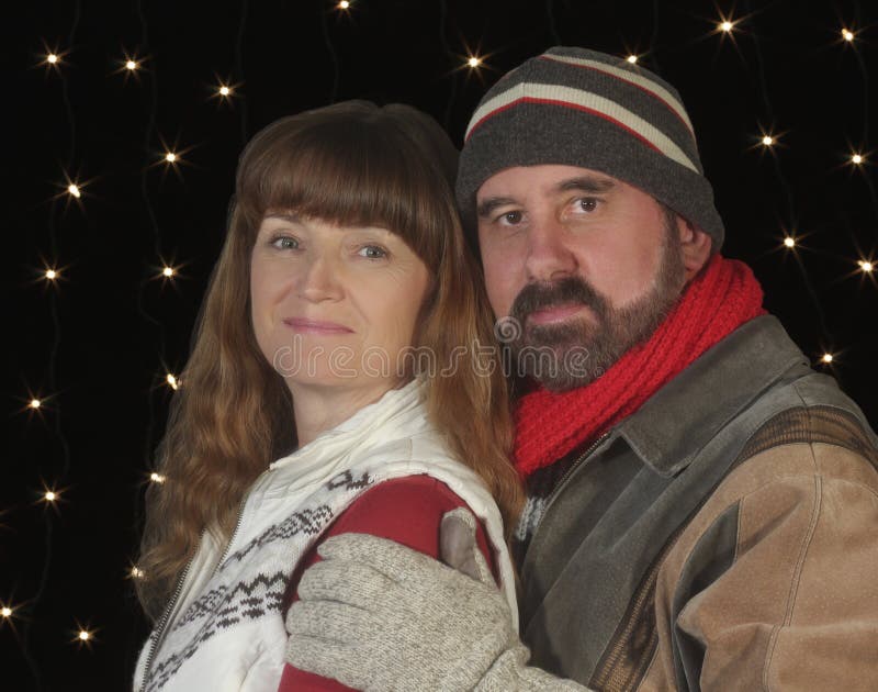 A Couple in Winter Clothes Snuggle Together Stock Photo - Image of ...