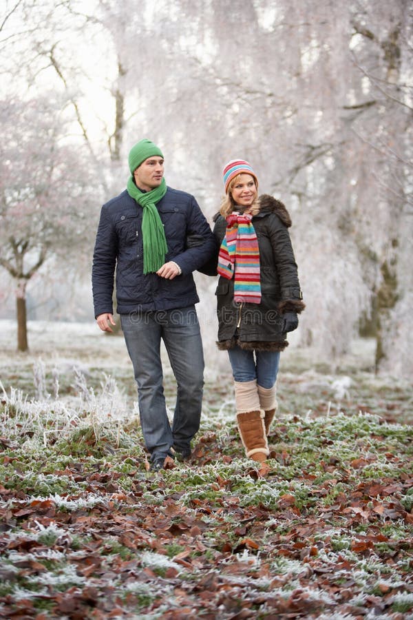 Couple on Winter Walk through Frosty Landscape Stock Image - Image of ...