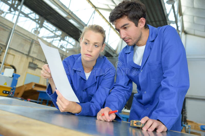 Couple Workers Reading Specification Stock Image - Image of artisan ...