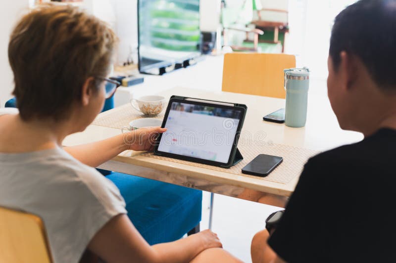Couple Working on Laptop Computer at Home. Stock Photo - Image of ...
