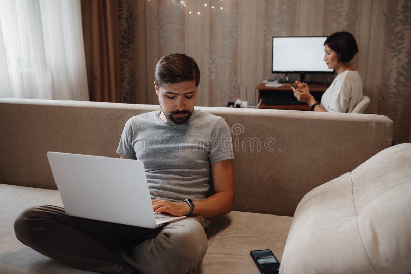 Couple Working and Playing with Laptop Computer at Home Stock Photo ...