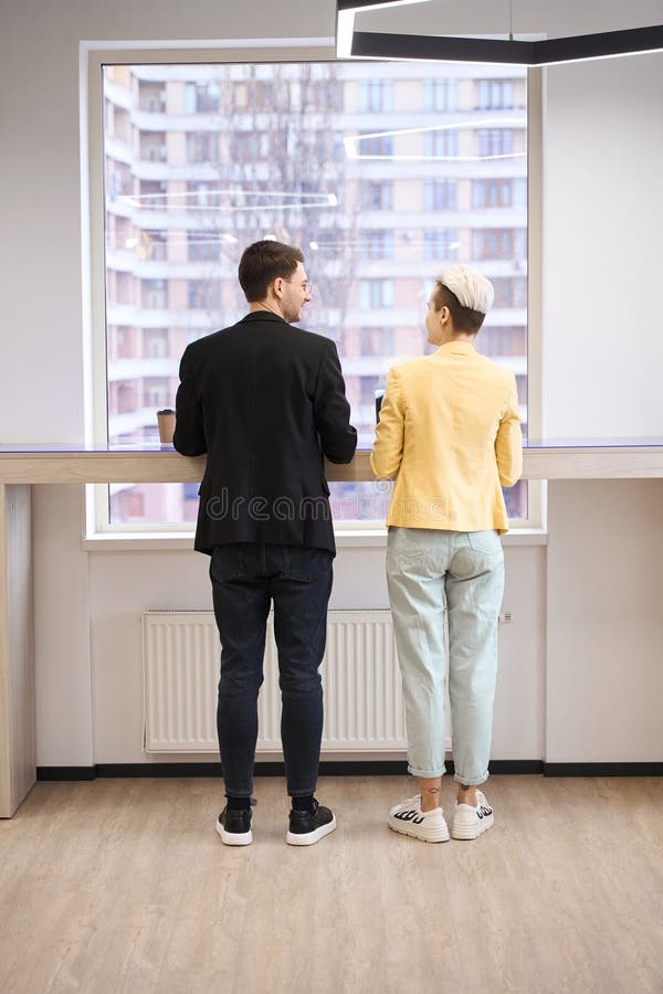 Couple Working on Project at Workplace Near Window Stock Image - Image ...