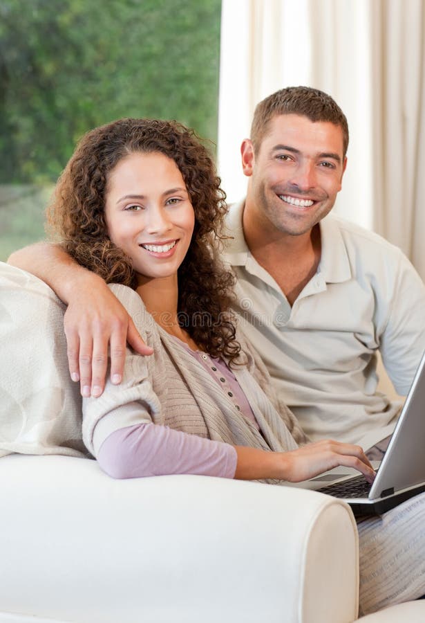 Couple Working on Their Laptop Stock Photo - Image of happy, listen ...