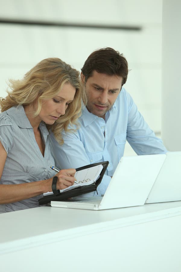 Couple writing in diary stock photo. Image of dark, white - 22690756