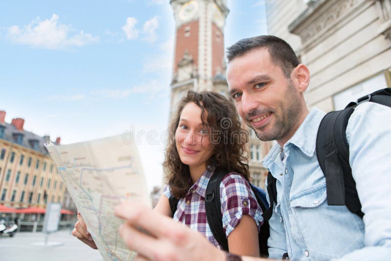 Couple of Young Attractive Tourists Watching Map Stock Photo - Image of ...