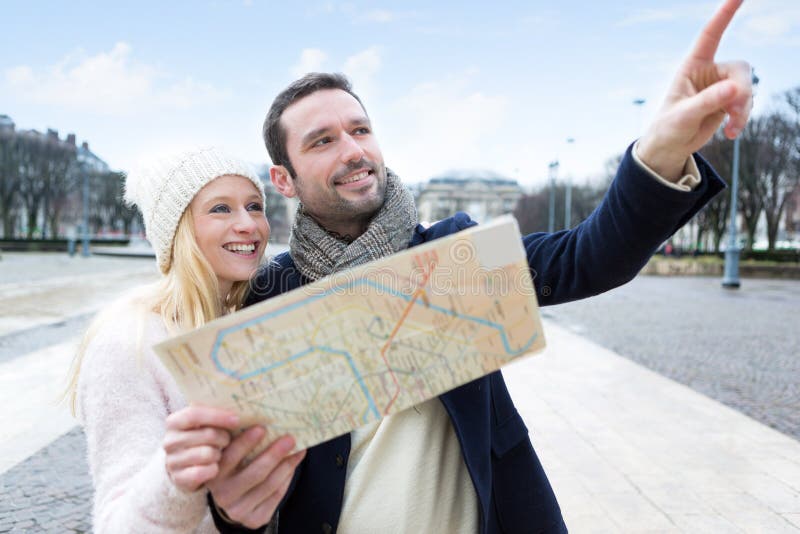 Couple of Young Attractive Tourists Watching Map Stock Photo - Image of ...