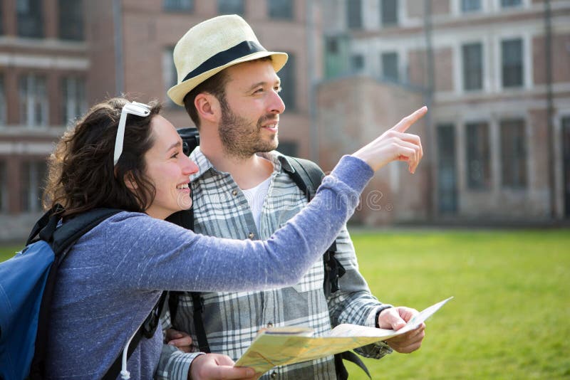 Couple of Young Attractive Tourists Watching Map Stock Photo - Image of ...