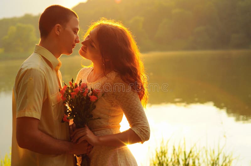 Couple of Young Lovers Hugging in the Sunset Light Stock Photo - Image ...