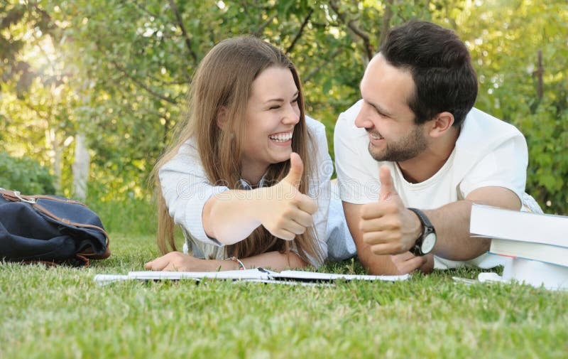 Couple of Young Students Have Fun while Studing in the Park Stock Photo ...