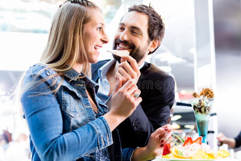 Couples Eating Fruit Sundae in Ice Cream Cafe Stock Image - Image of ...