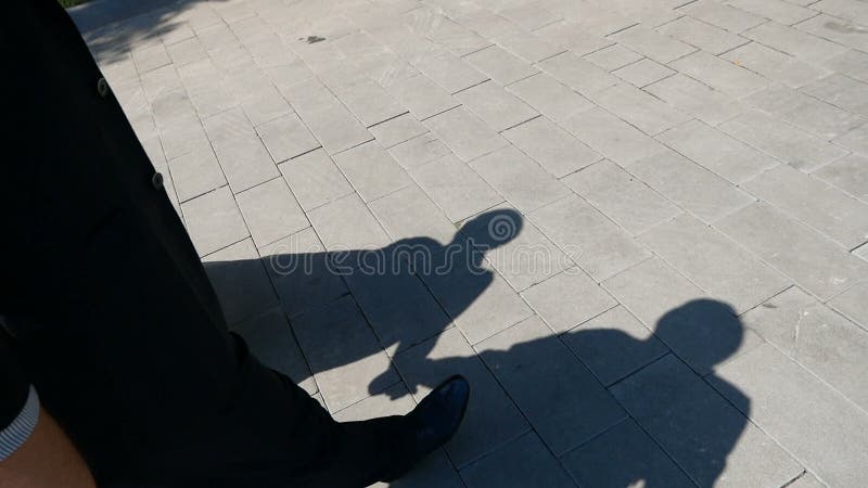 A Couples Shadow Holding Hands and Going Together Hand in Hand Stock ...