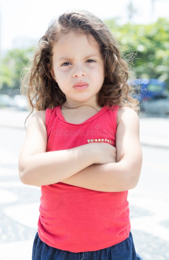 Courageous Child in a Red Shirt Outside Looking at Camera Stock Image ...