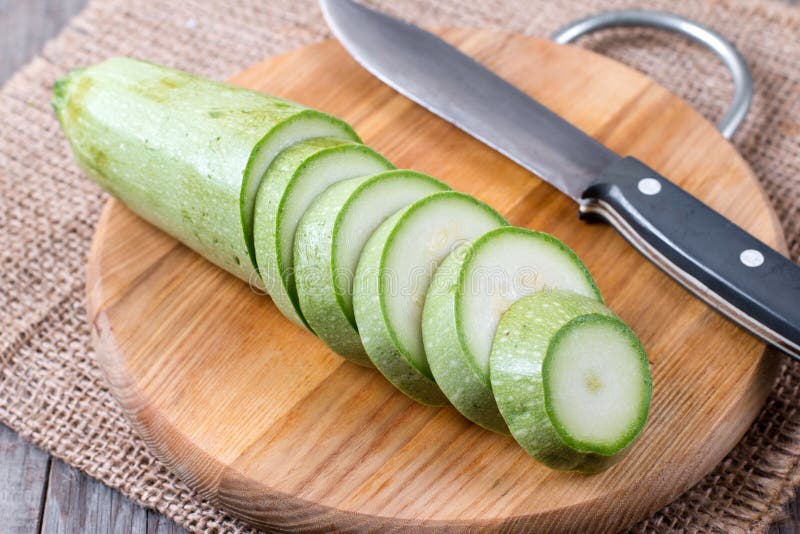 Courgette Cut on Slices on Cutting Board Stock Photo - Image of market ...
