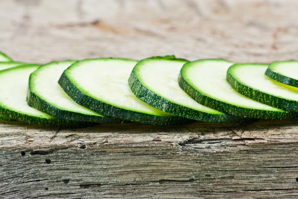 Courgette Cut To Slices on Breadboard Stock Photo - Image of ingredient ...