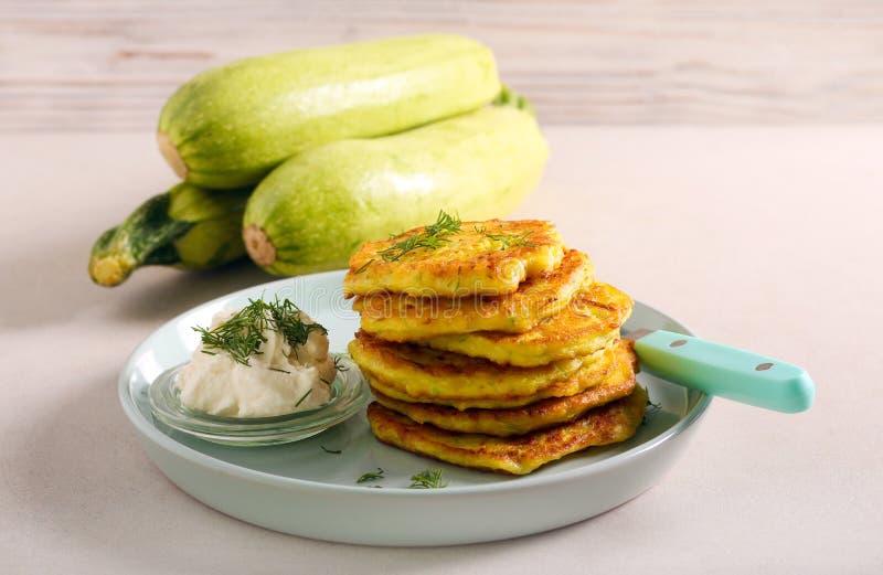 Courgette fritters, served stock photo. Image of food - 188838650