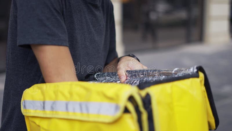 Courier with Backpack Look Inside for Details on Order Receipt Stock ...