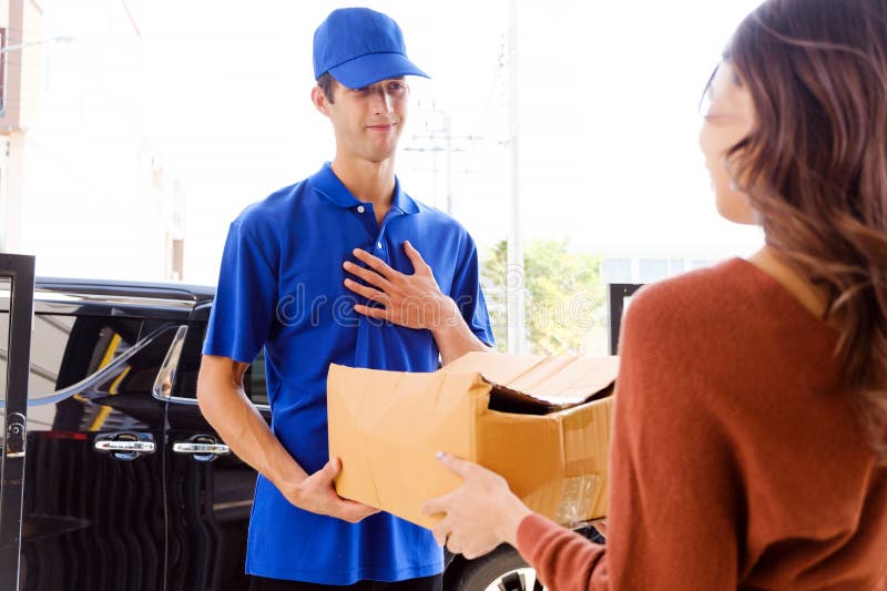 Courier in Blue Uniform Apologizes To a Customer Receiving a Damaged ...