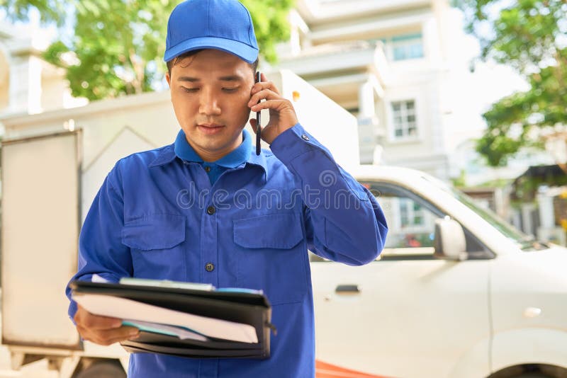 Courier calling client stock image. Image of post, document - 138130131