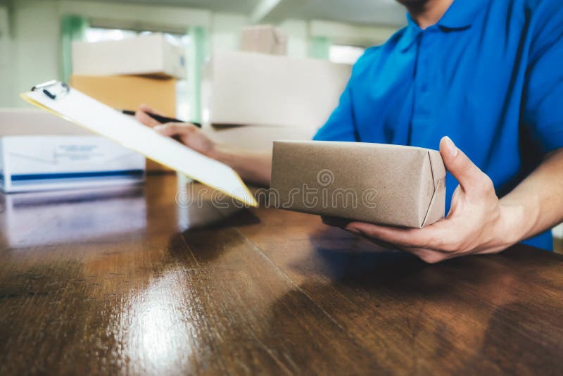 Courier Checking the Delivery Receipt List in Office. Stock Image ...