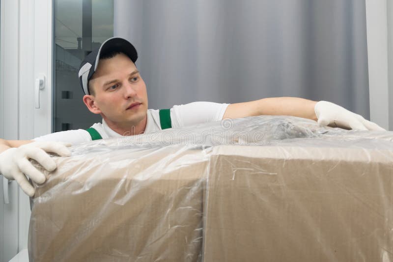 The Courier Delivered a Large Parcel To the Customer Stock Photo ...