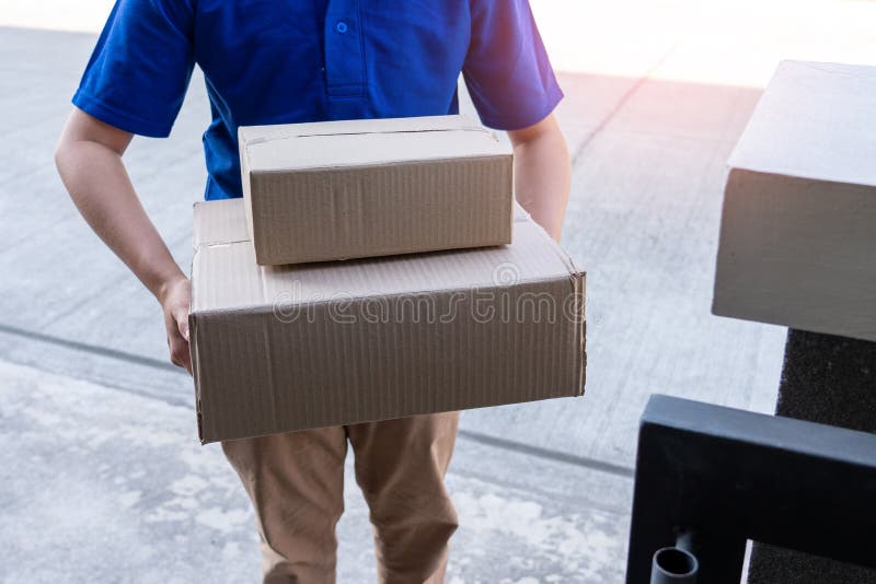 Courier Delivery Man Checking or Holding Cardboard Parcel Package To ...