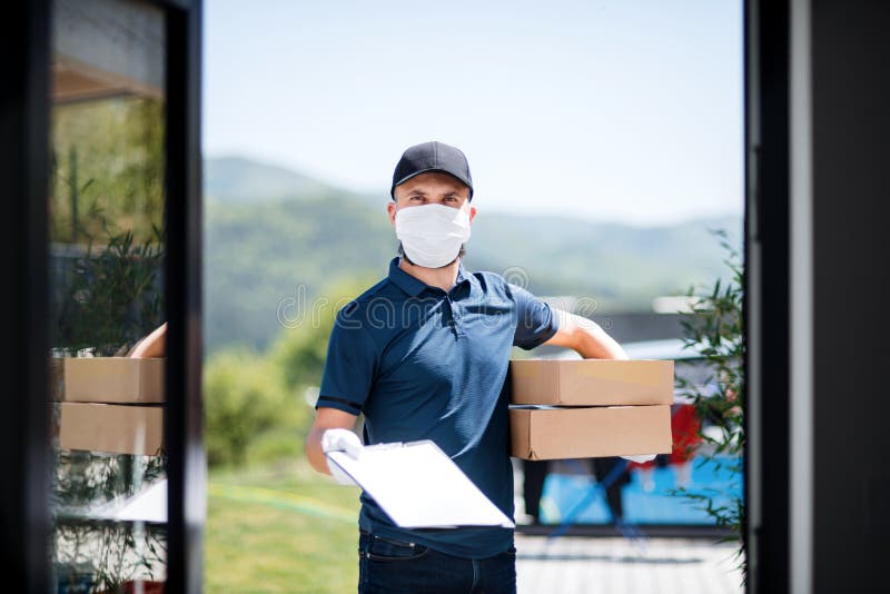 Courier with Face Mask Delivering Parcel, Corona Virus and Quarantine ...