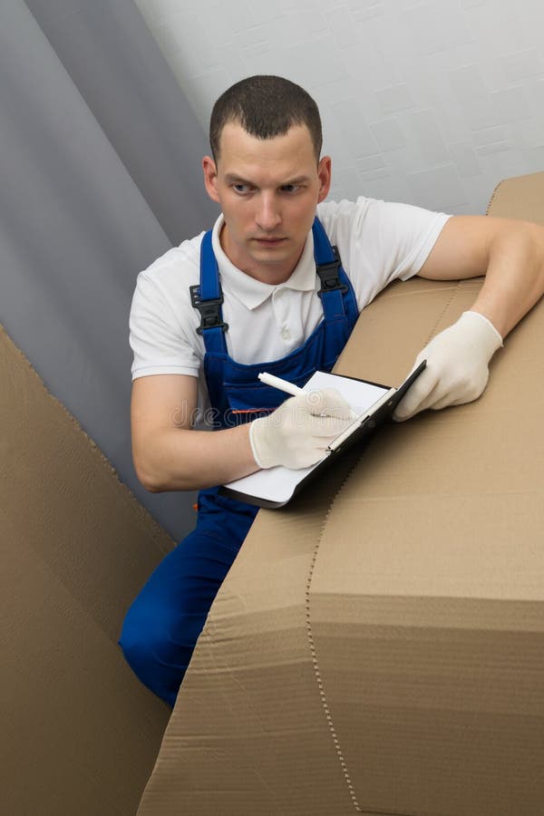 The Courier Fills Out the Documents after the Delivery of the Goods and ...