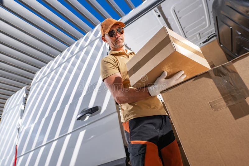 Courier Holding Boxes Next To Delivery Van Stock Photo - Image of ...