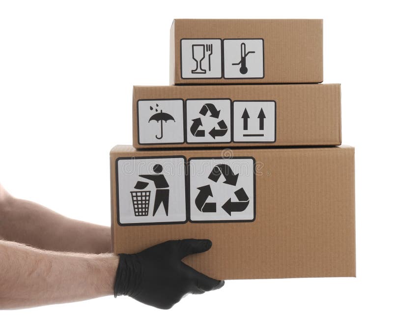 Courier Holding Cardboard Boxes with Different Packaging Symbols on ...