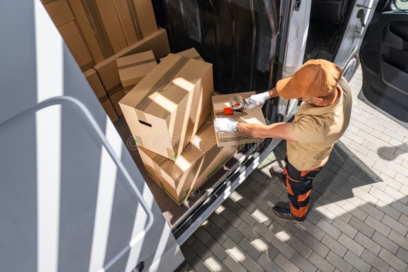 Courier Loading Boxes into His Cargo Van Stock Image - Image of ...