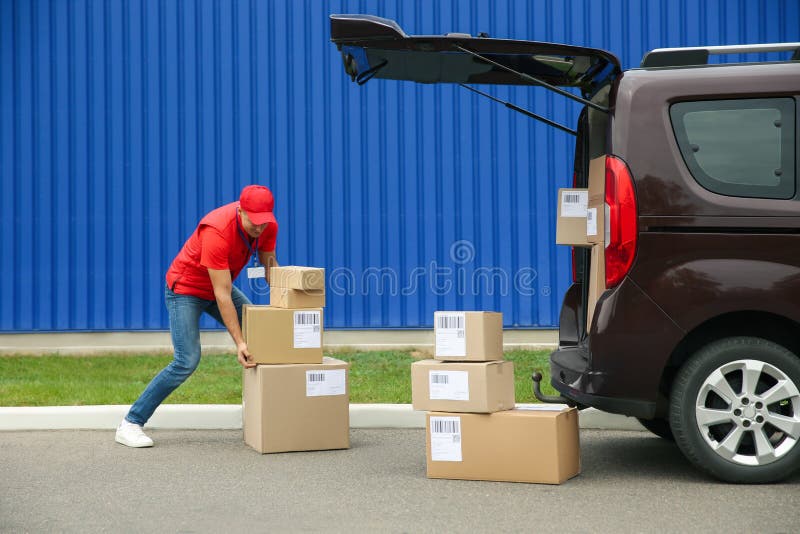Courier Loading Packages in Car Trunk Outdoors Stock Photo - Image of ...