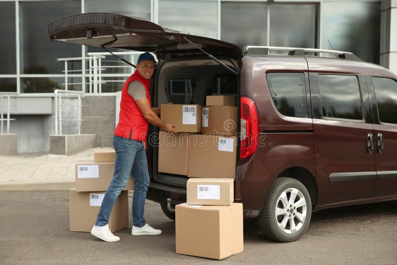Courier Loading Packages in Car Trunk Outdoors Stock Photo - Image of ...