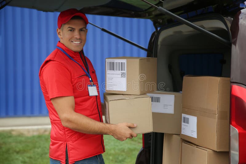 Courier Loading Packages in Car Trunk Outdoors Stock Image - Image of ...