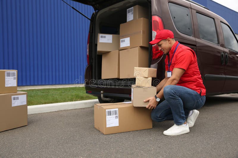 Courier Loading Packages in Car Trunk Outdoors Stock Photo - Image of ...