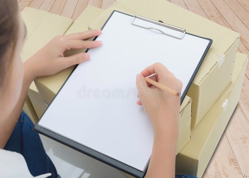 Courier Making Notes in Delivery Receipt among Parcels on Boxes Stock ...
