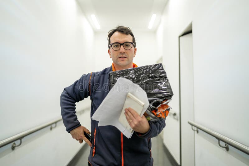 Courier with the Package and Documents Hurrying in White Corridor Stock ...