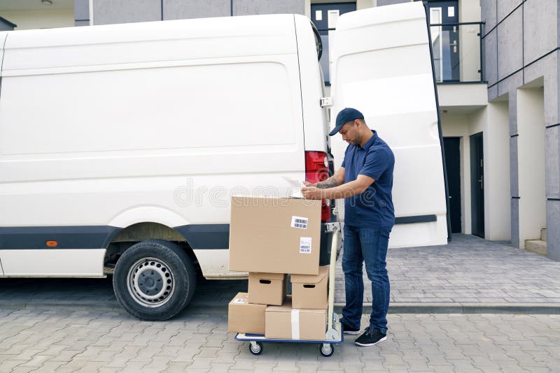 Delivery man at work stock photo. Image of cardboard - 224812206