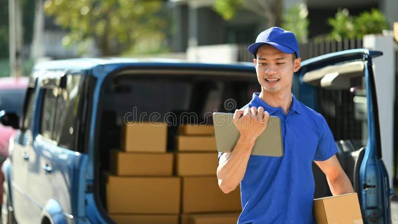 Courier with Parcel Standing Front of the Delivery Service Van while ...