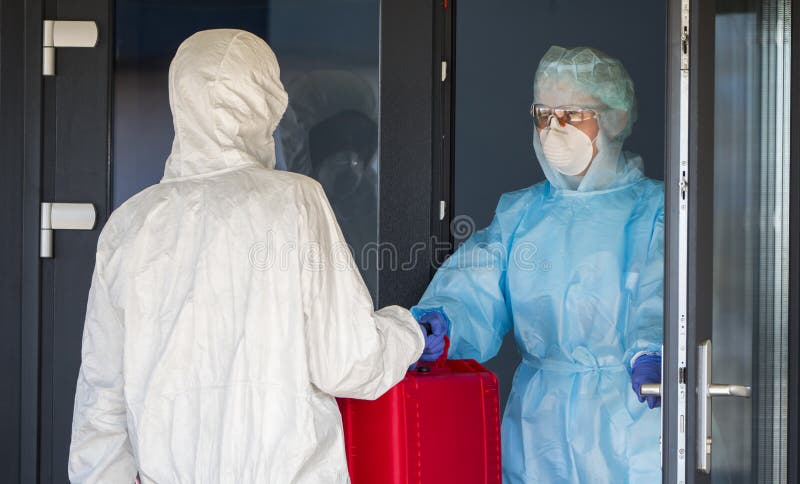 A Courier in a Protective Suit Hands the Doctor a Red Case with ...