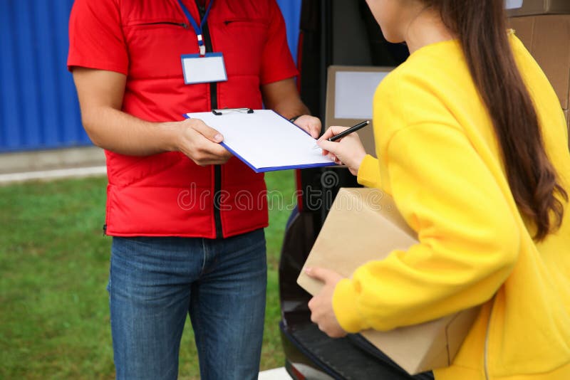 Courier Receiving Receipt Signature from Customer Outdoors, Closeup ...
