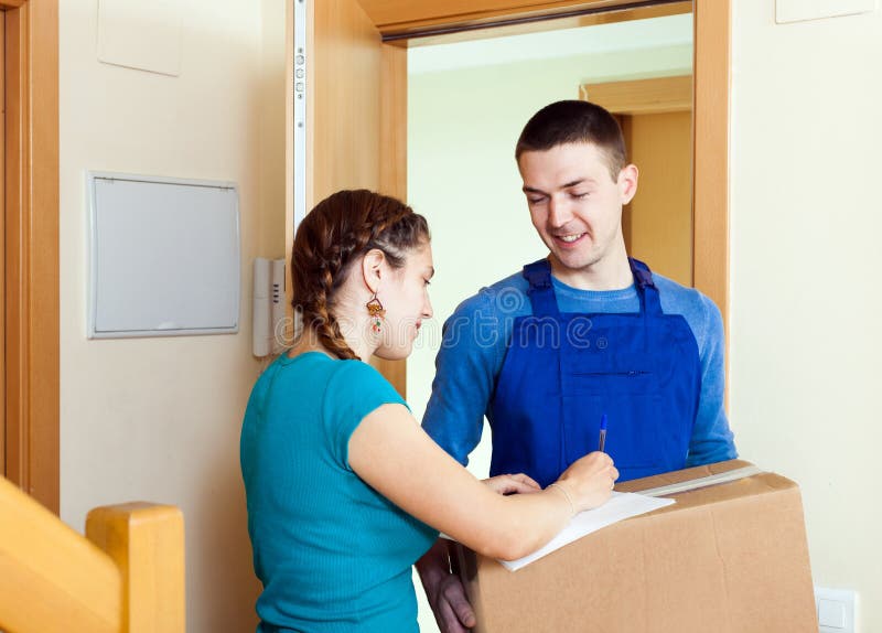Receiving a Package at Home Stock Image - Image of occupation, male ...