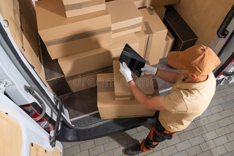 Courier Unloading Shipping Boxes from Truck Stock Image - Image of ...