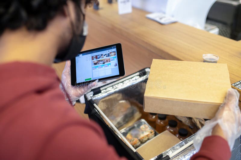 Courrier Checking the Order for Food Delivery Stock Image - Image of ...