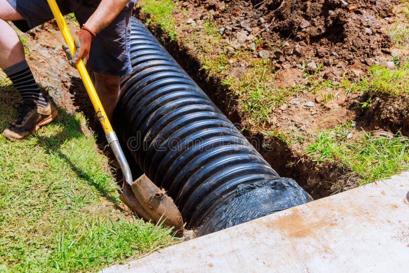 In Course of Construction, Drainage Black Pipe is Installed in a Trench ...