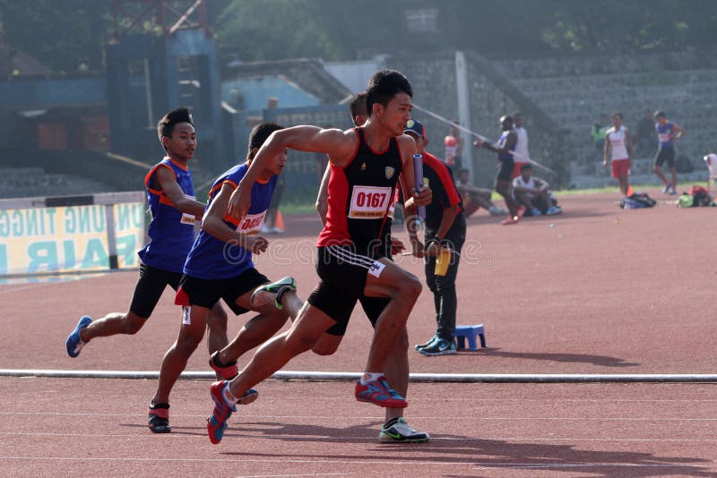 Course de relais photographie éditorial. Image du relais - 54463092