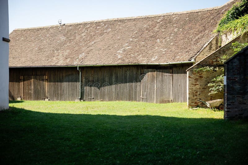 Courtyard with Green Grass and Brick Walls Stock Image - Image of ...