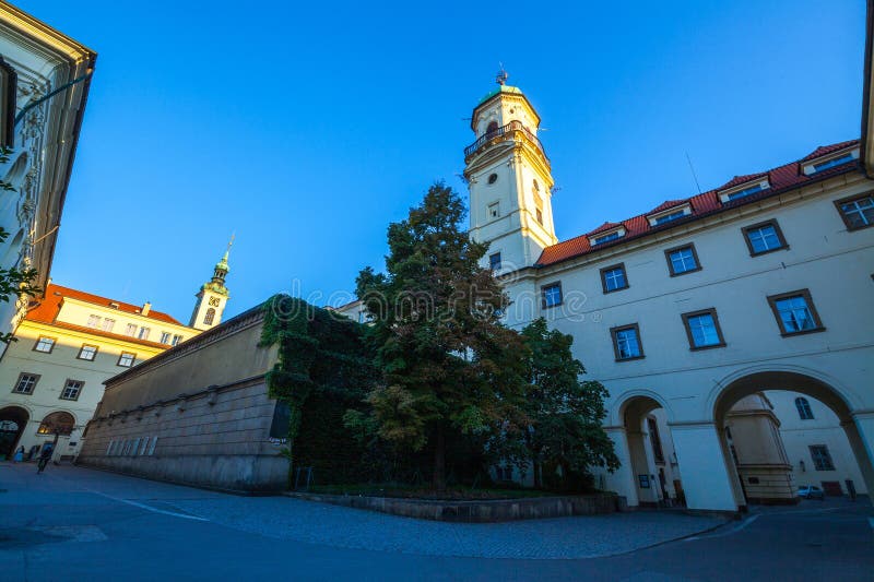 A Courtyard with Historic Buildings, Featuring a Tall Tower with a ...