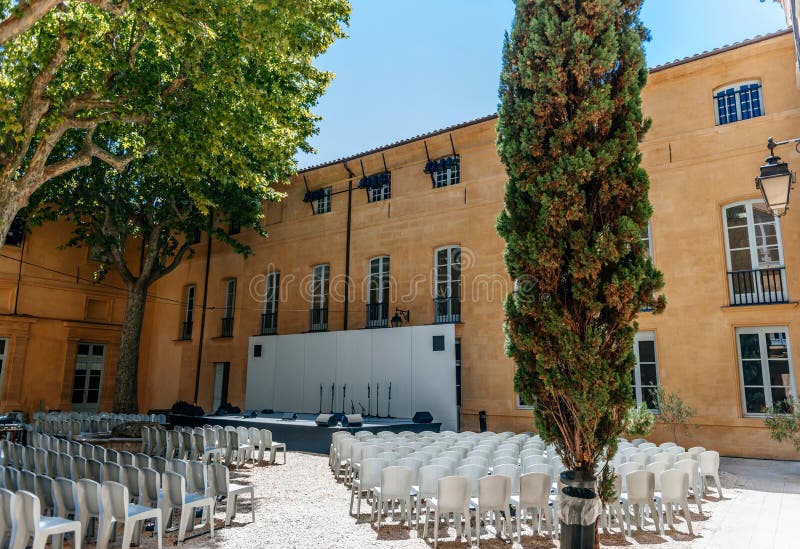 Courtyard Prepped for Event Amidst Trees and Building Stock Image ...