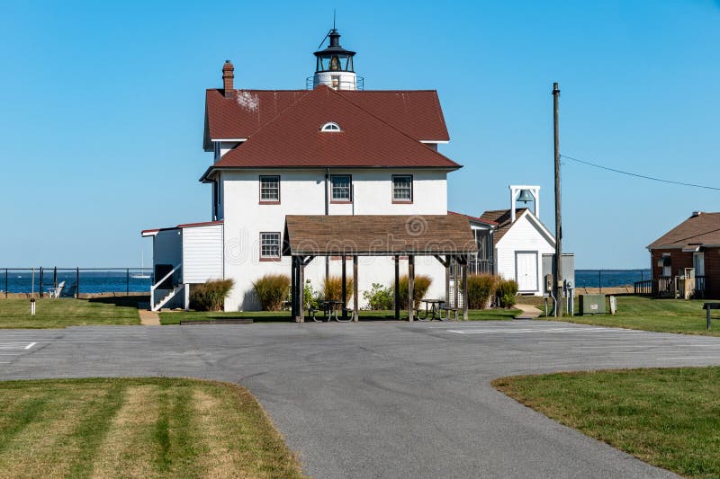 Cove Point Lighthouse in Maryland Stock Photo - Image of blue, water ...